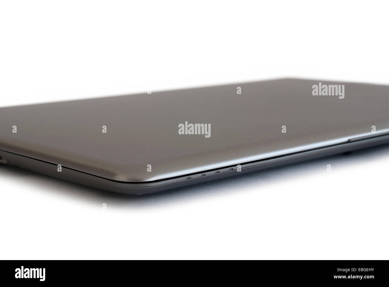 Closed laptop computer on a white background Stock Photo - Alamy