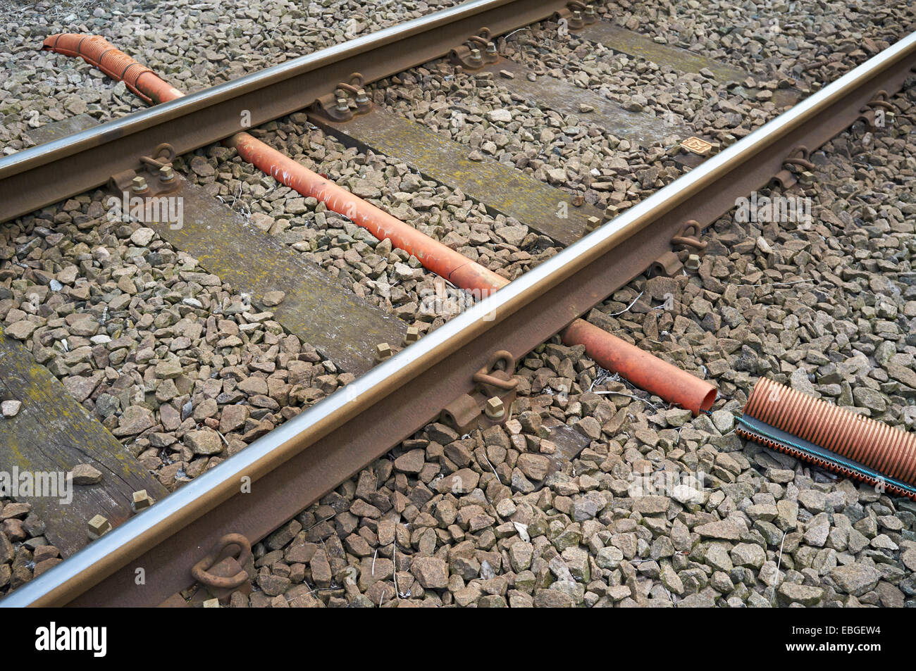 Railway tracks & cable tube Stock Photo - Alamy