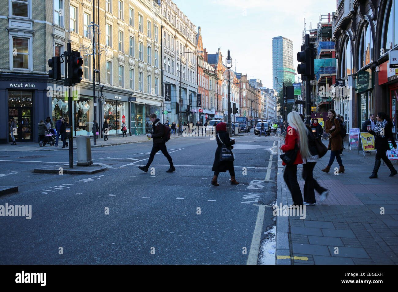 Pedestrians crossing the street on Tottenham Court Road London Stock ...