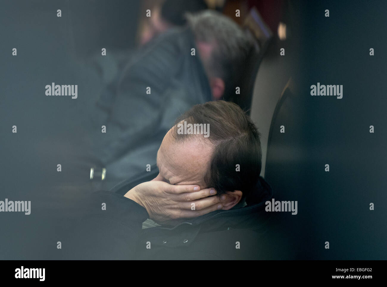 Frankfurt, Germany. 01st Dec, 2014. Passengers sleep at the airport in ...