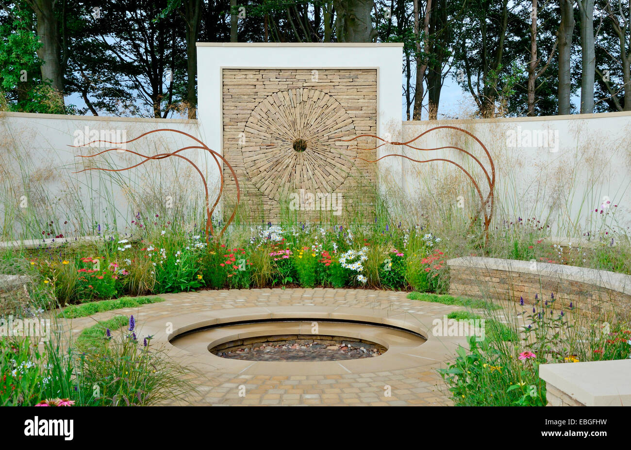 A enclosed garden designed to show the role of wind and water with ...
