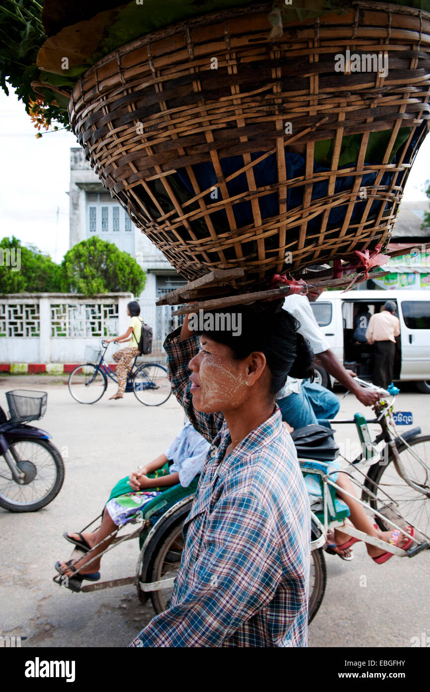 Myanmar traffic, bucket on head transport Stock Photo - Alamy