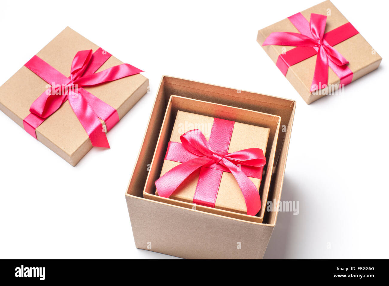 Three gift boxes packed into one another isolated on white Stock Photo ...