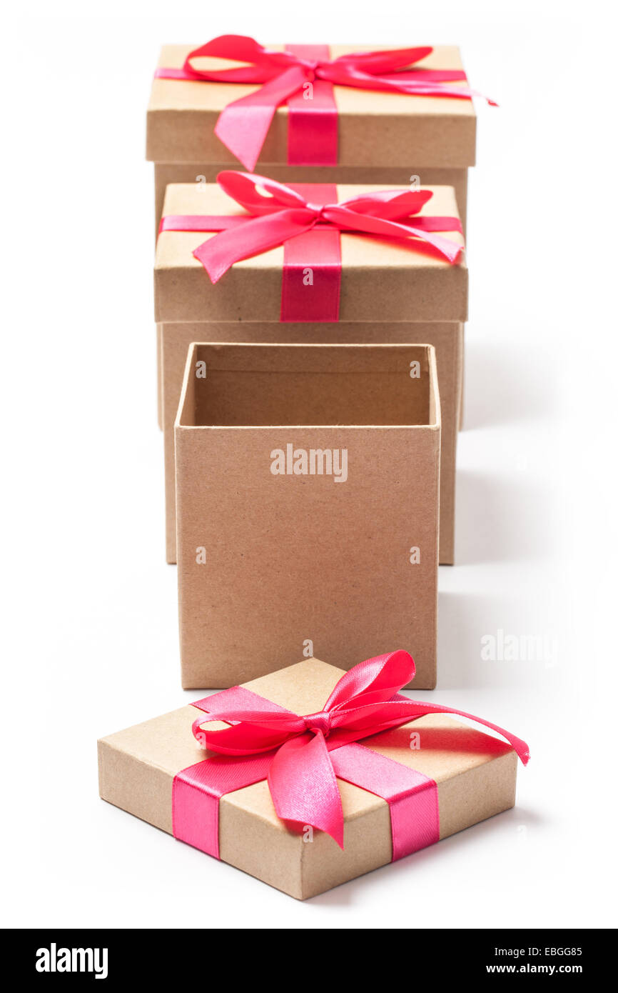 Three carton gift boxes with red ribbons isolated on white Stock Photo ...