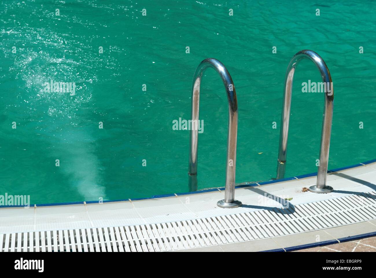 Swimming pool with stair and green relaxing water Stock Photo - Alamy
