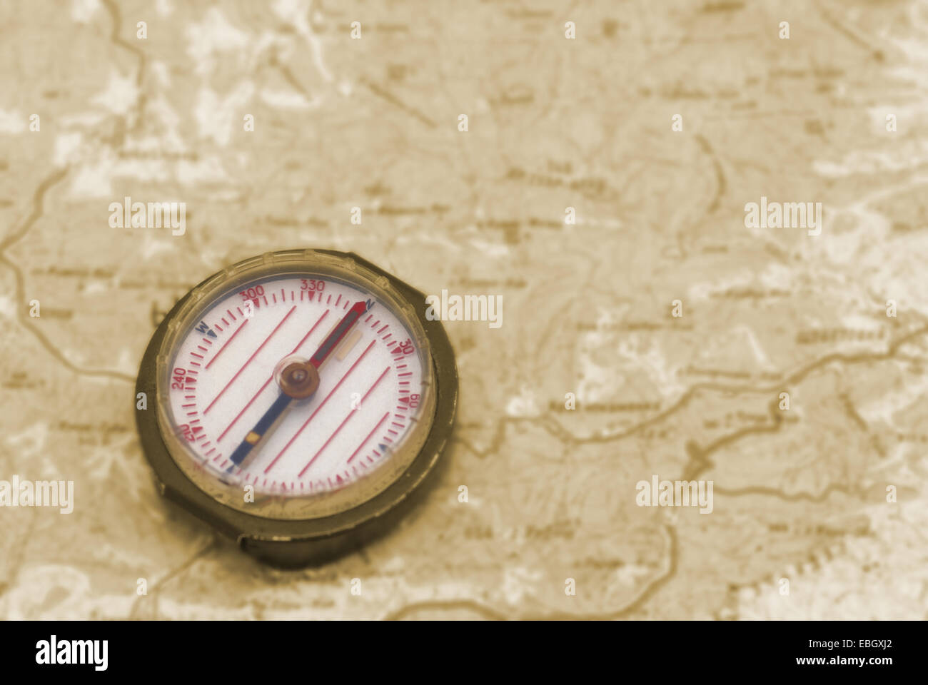 Compass over the topographic map- concept background Stock Photo - Alamy