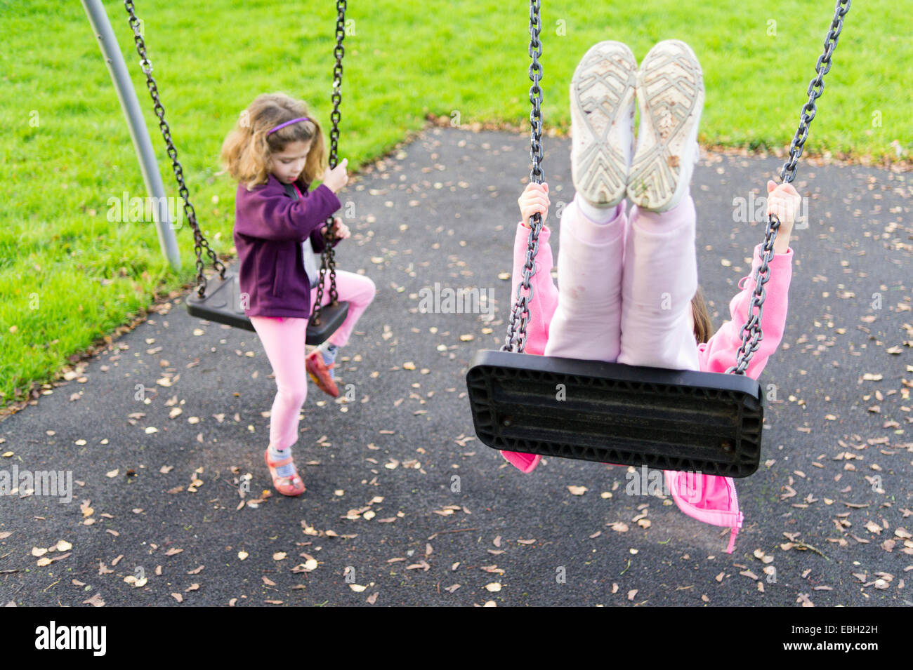 Children on swings hi-res stock photography and images - Alamy