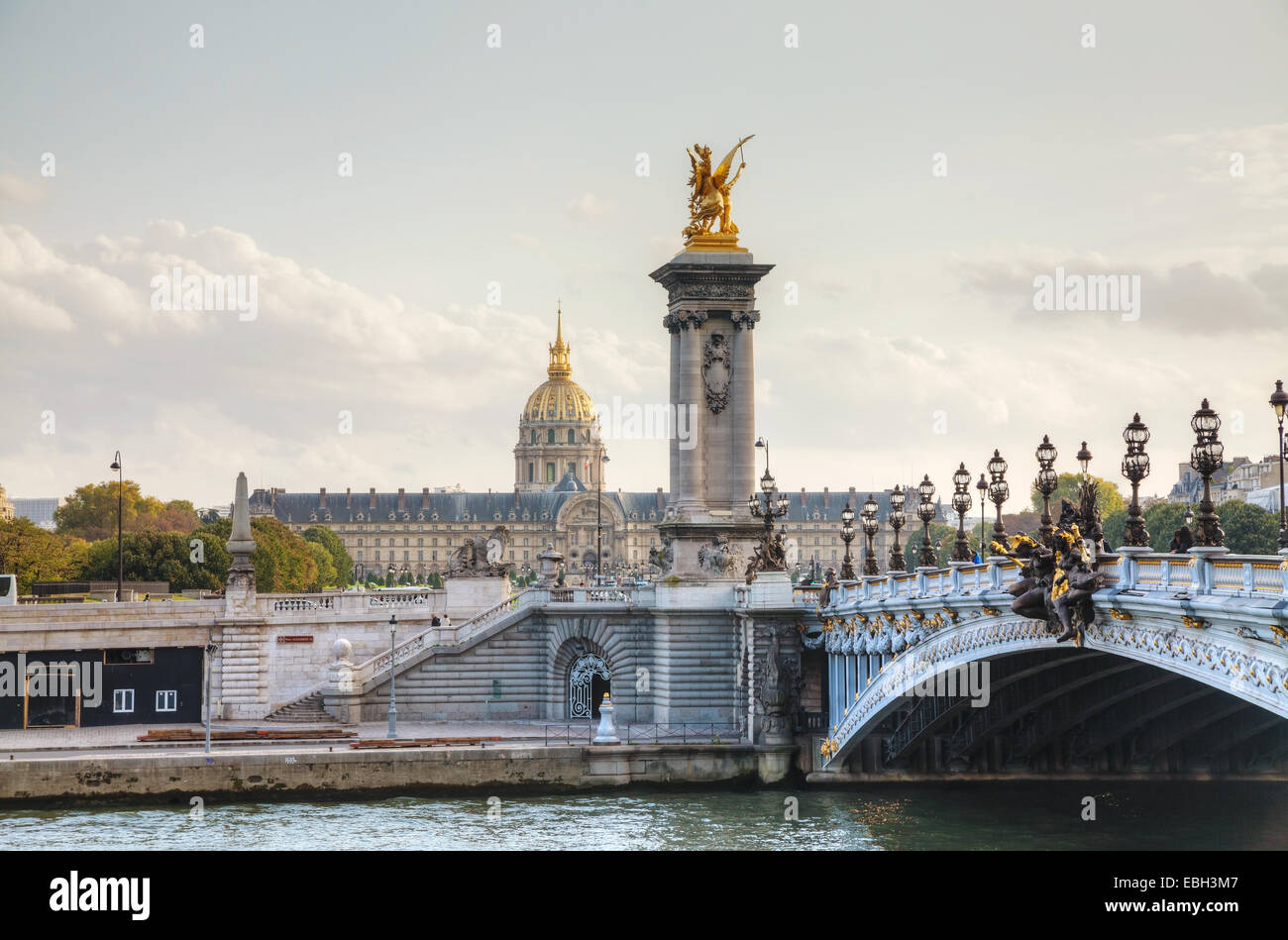 Alexander III bridge and Les Invalides building in Paris, France Stock ...