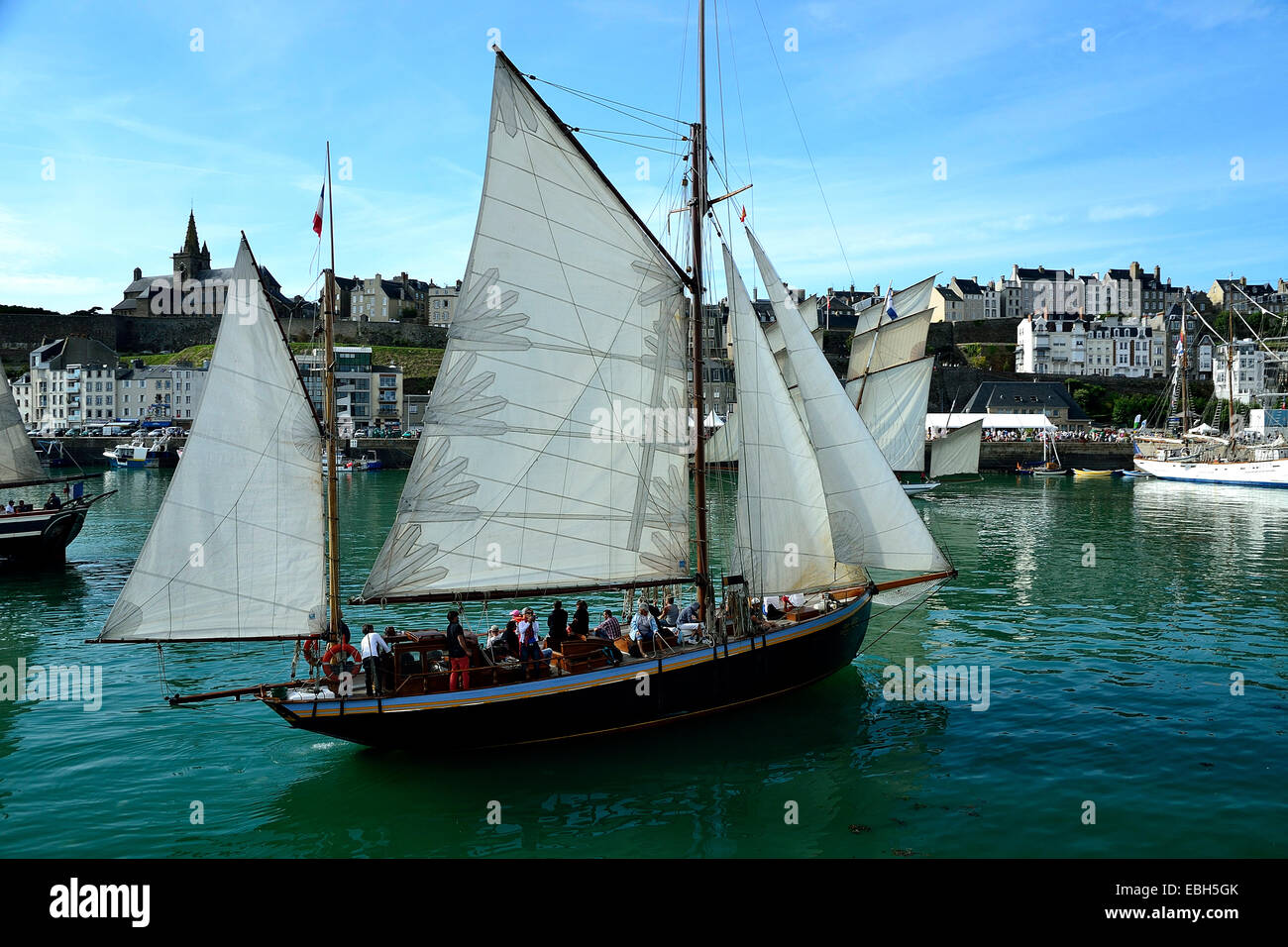 Classic yacht 'Lys noir' parade under sail into the port of Granville ...