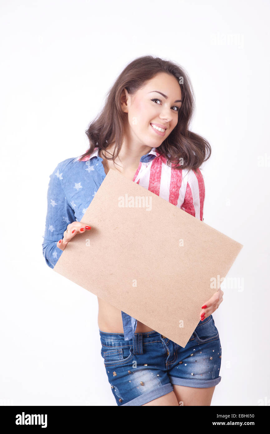 Cute smiling girl with a sign in hands Stock Photo - Alamy