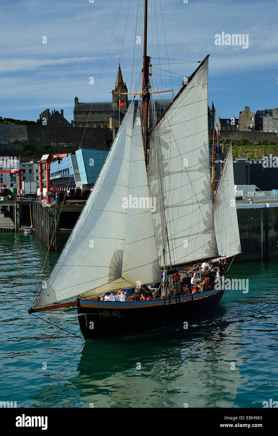Classic yacht 'Lys noir'parade under sail into the port of Granville ...