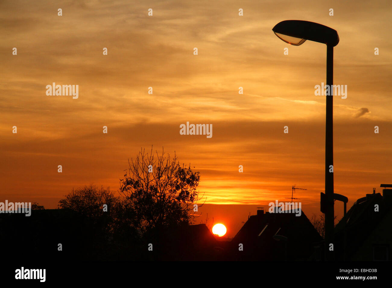 sunset over a suburb, Germany Stock Photo - Alamy