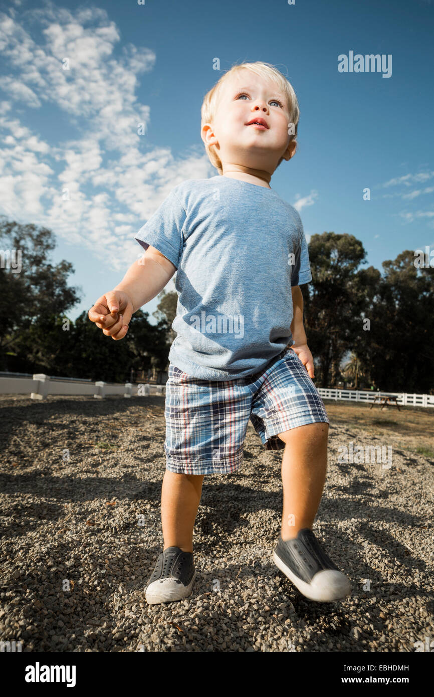 Young boy walking Stock Photo - Alamy