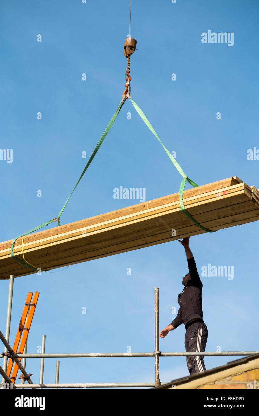 Construction crane lifting pallet building hi-res stock photography and ...