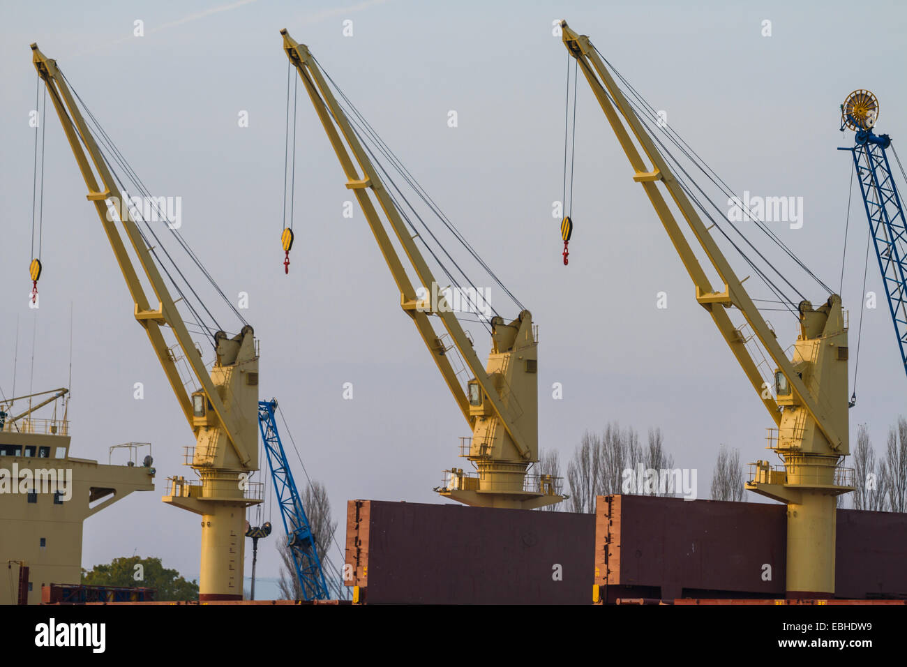 Industrial Container Cargo freight ship with working crane bridge in ...