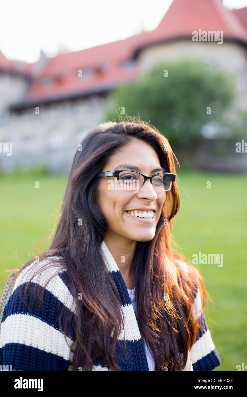 Student wearing glasses, smiling Stock Photo - Alamy