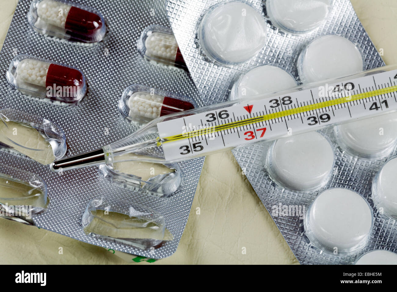 The medical thermometer and medicines in tablets Stock Photo - Alamy