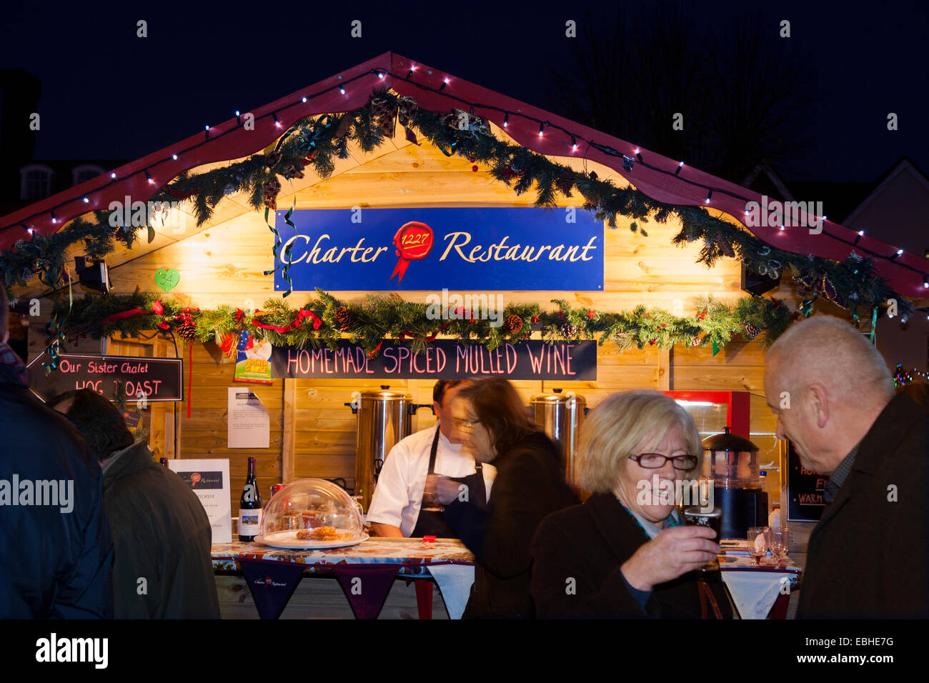 People enjoy mulled wine at the Christmas market in the city of ...