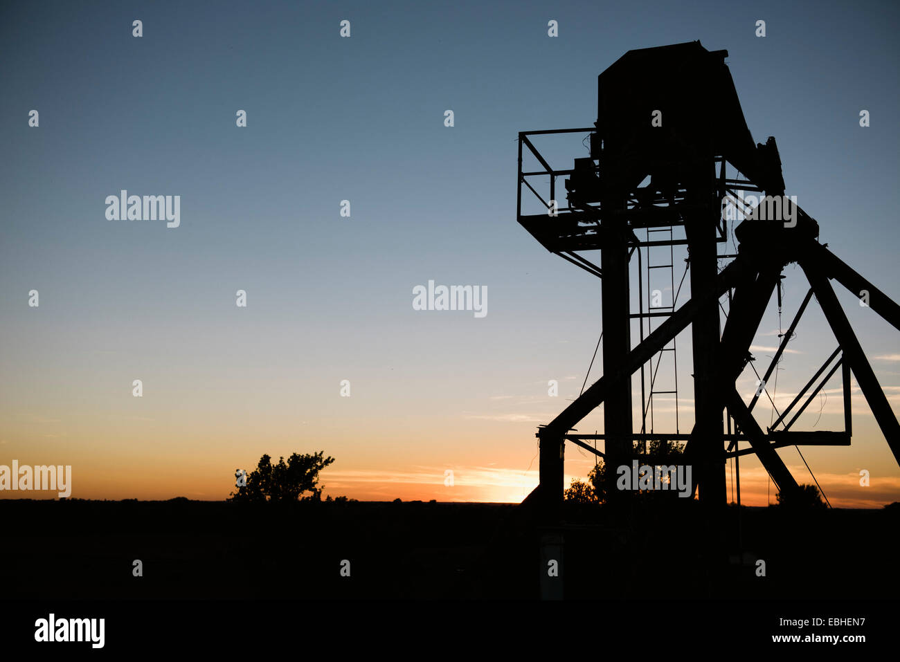 Silhouetted agricultural structure at sunset Stock Photo - Alamy