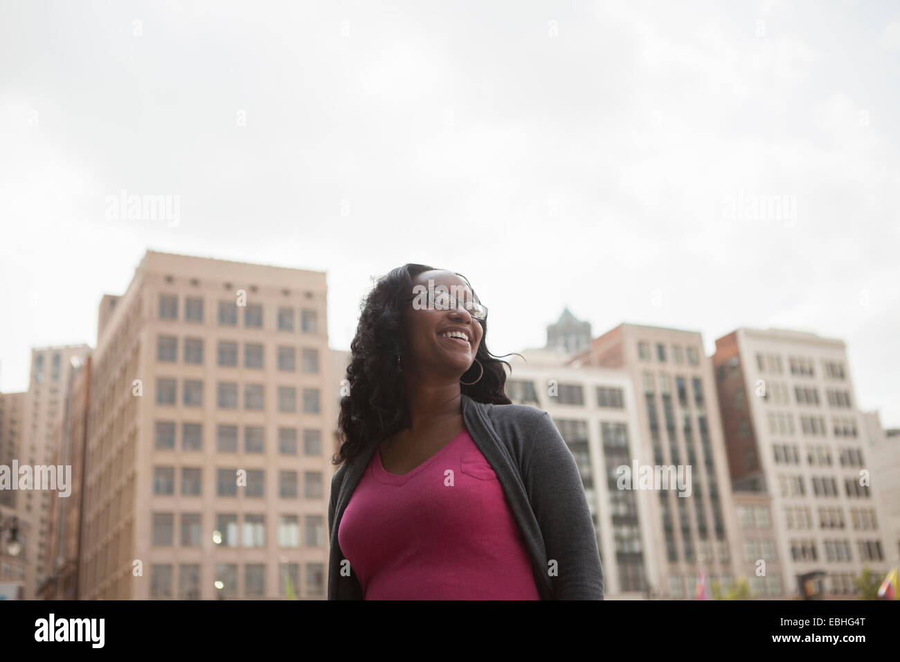 Low angle portrait of smiling woman, Detroit, Michigan, USA Stock Photo ...