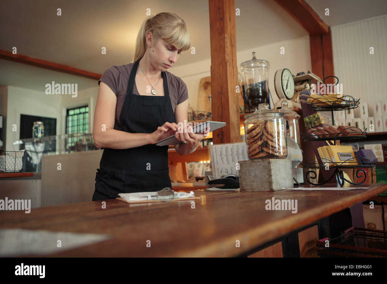 Female store assistant hi-res stock photography and images - Alamy