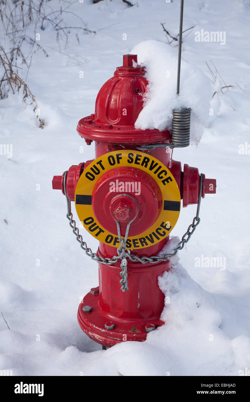A New England fire hydrant is topped with snow. this hydrant is new and ...