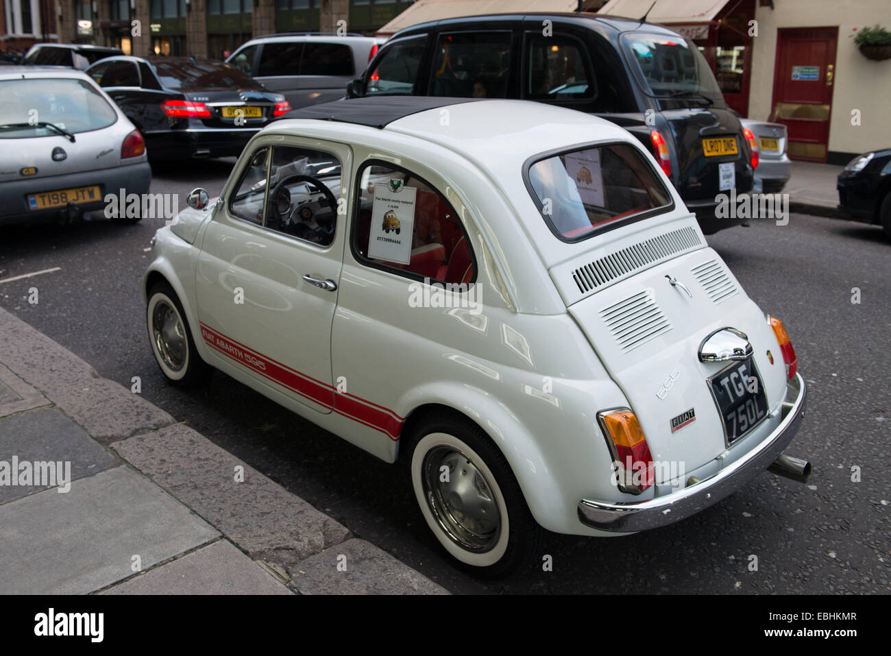Expensive cars parked by Harrods in West London Stock Photo - Alamy