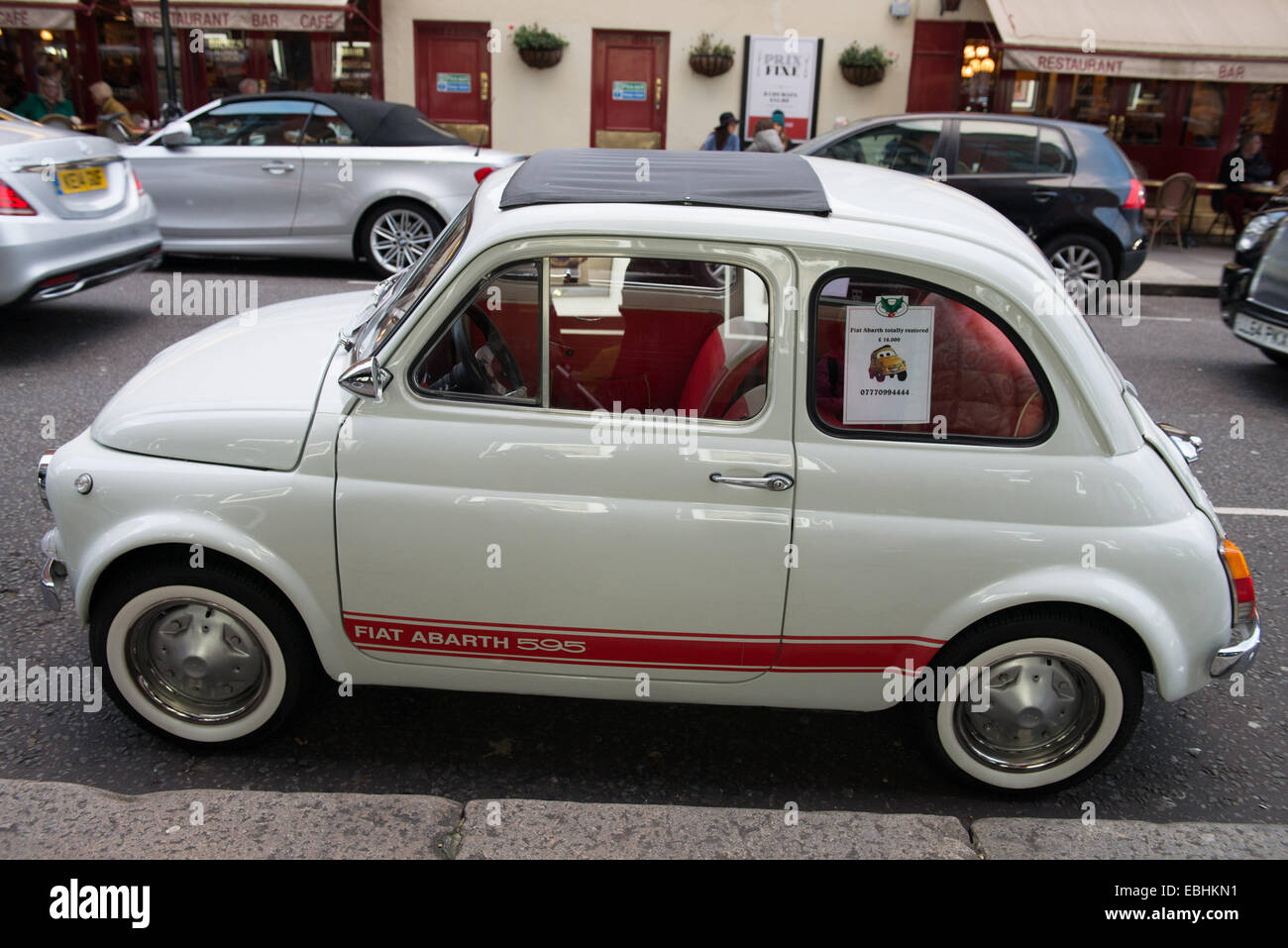 Expensive cars parked by Harrods in West London Stock Photo - Alamy