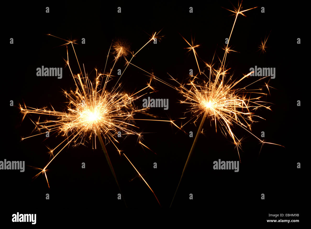 Two burning christmas sparklers Stock Photo - Alamy