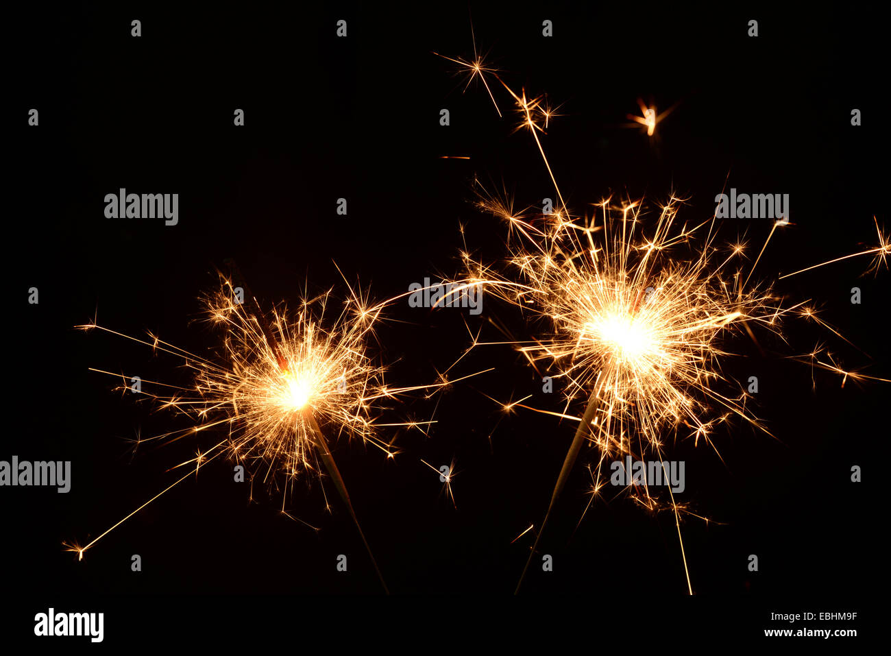 Holiday celebration background burning sparklers hi-res stock ...