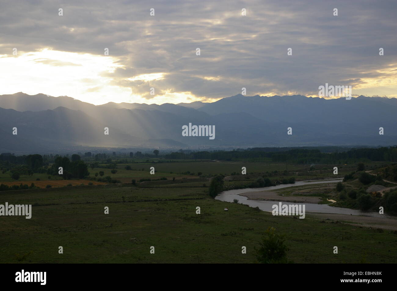 Sunset in the plain Stock Photo - Alamy