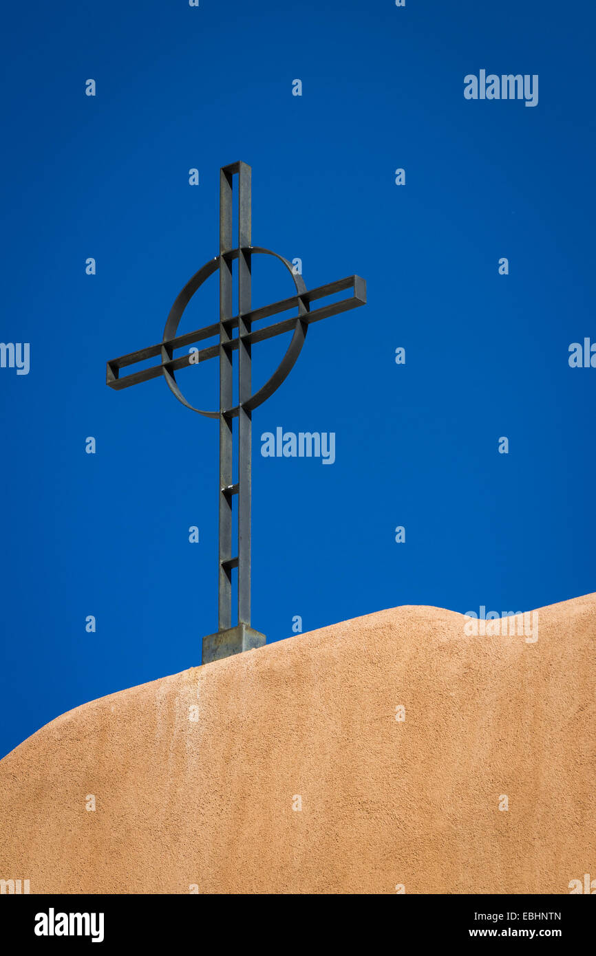 close up of a Christian cross on top of a church with the traditional ...