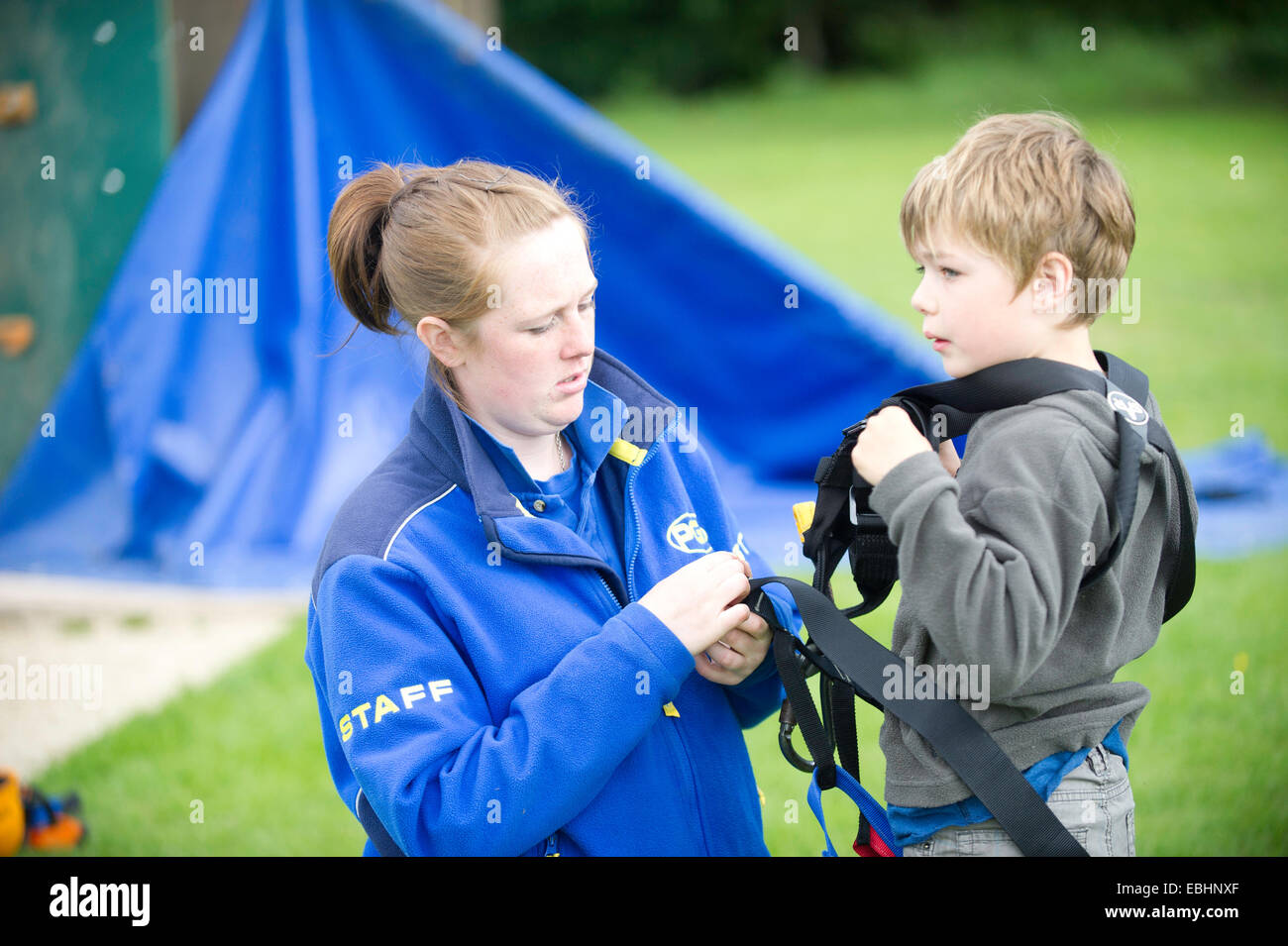 Kids learning to climb on an adventure school Stock Photo - Alamy