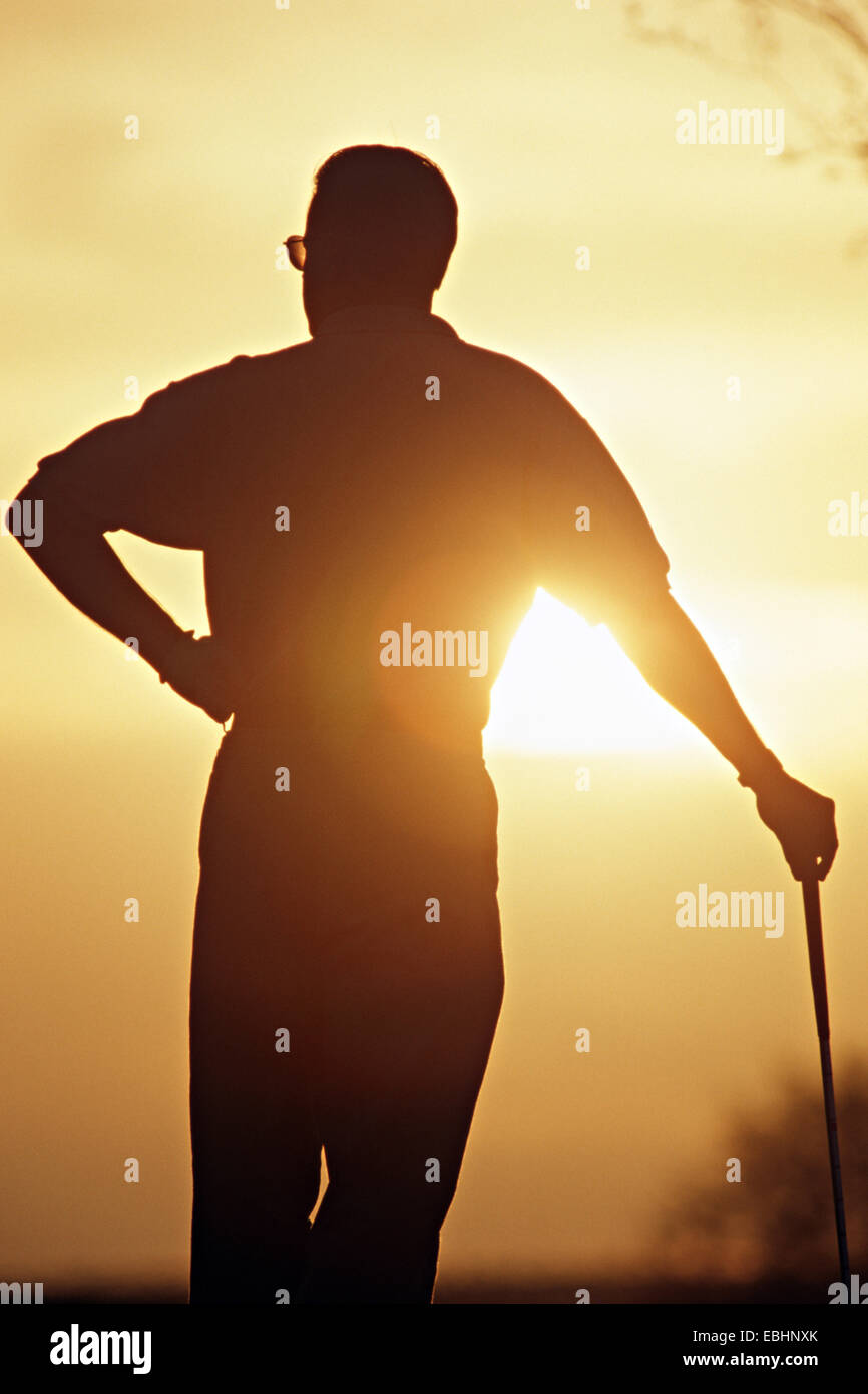 Silhouette of Golfer at Sunset Stock Photo - Alamy