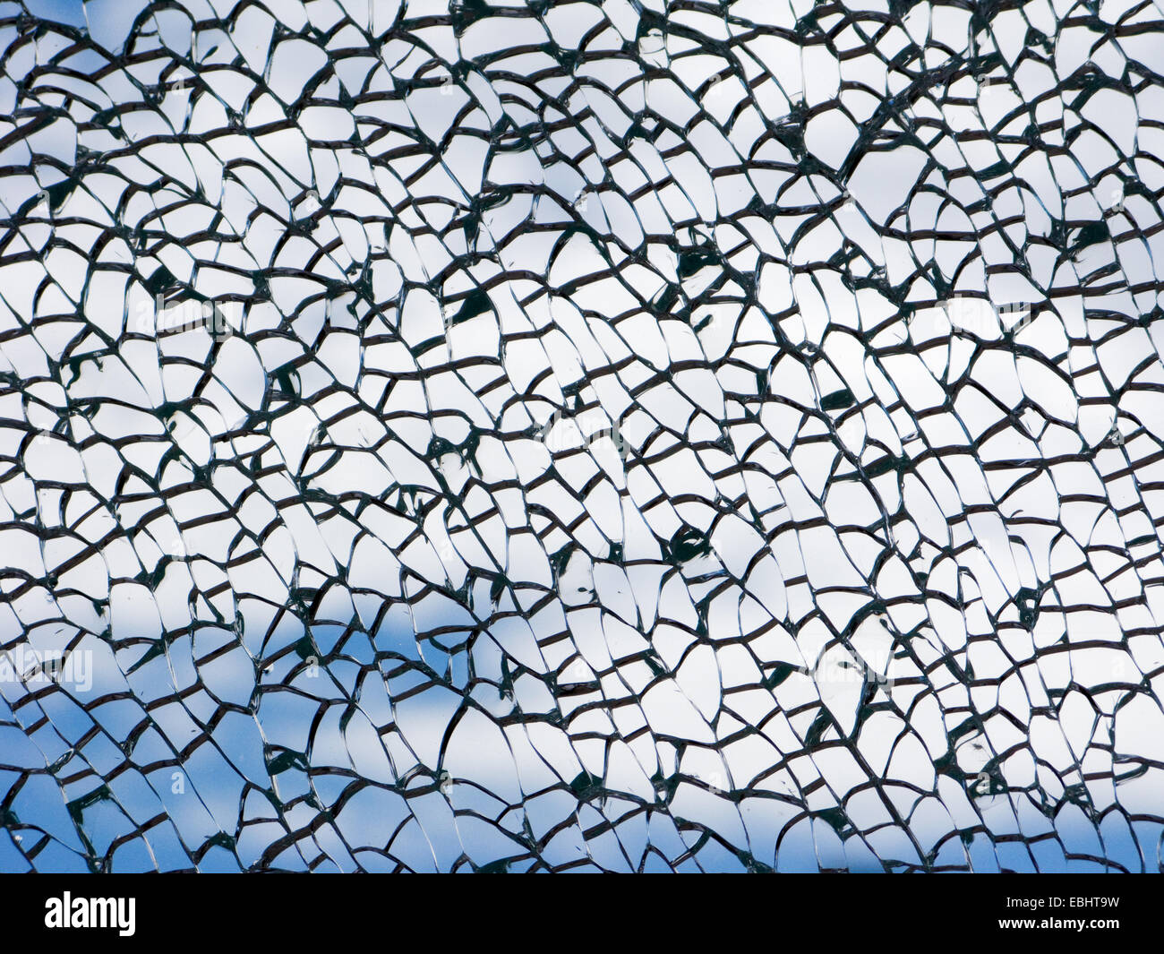 Cloudy sky seen through a shattered glass window Stock Photo - Alamy