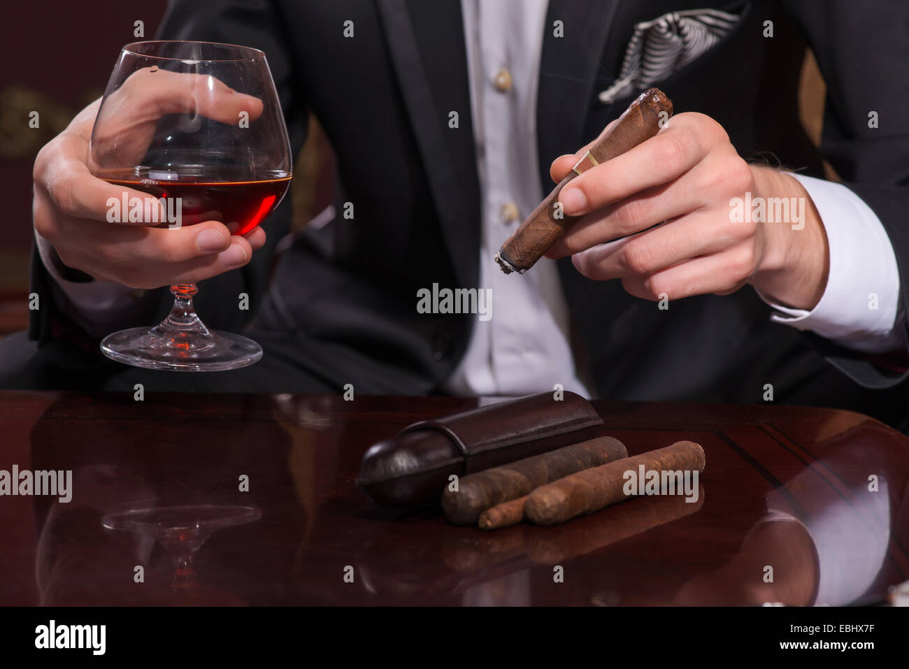 Handsome man with cigar Stock Photo - Alamy