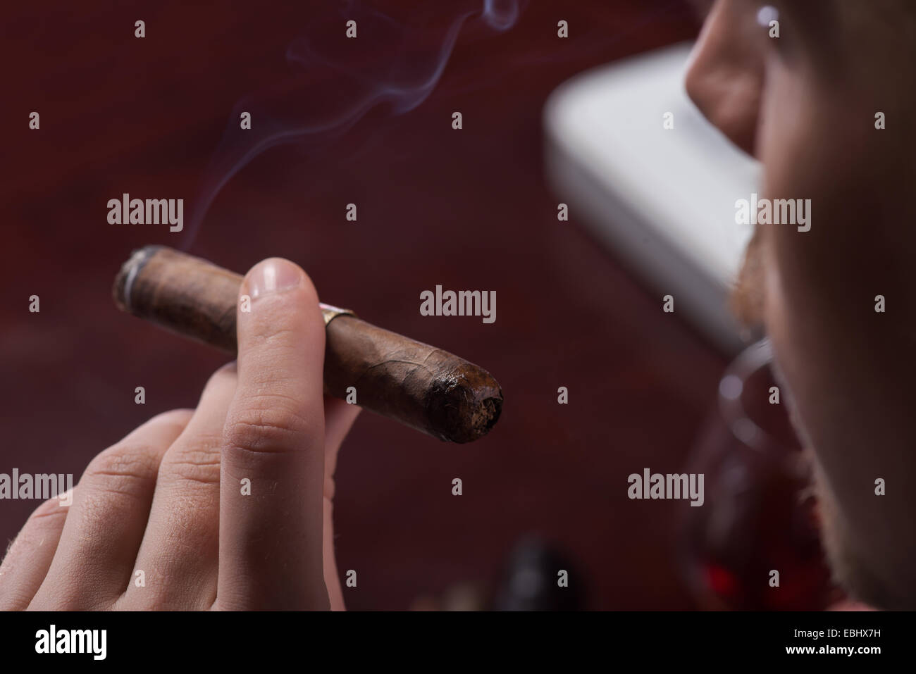 Handsome man with cigar Stock Photo - Alamy