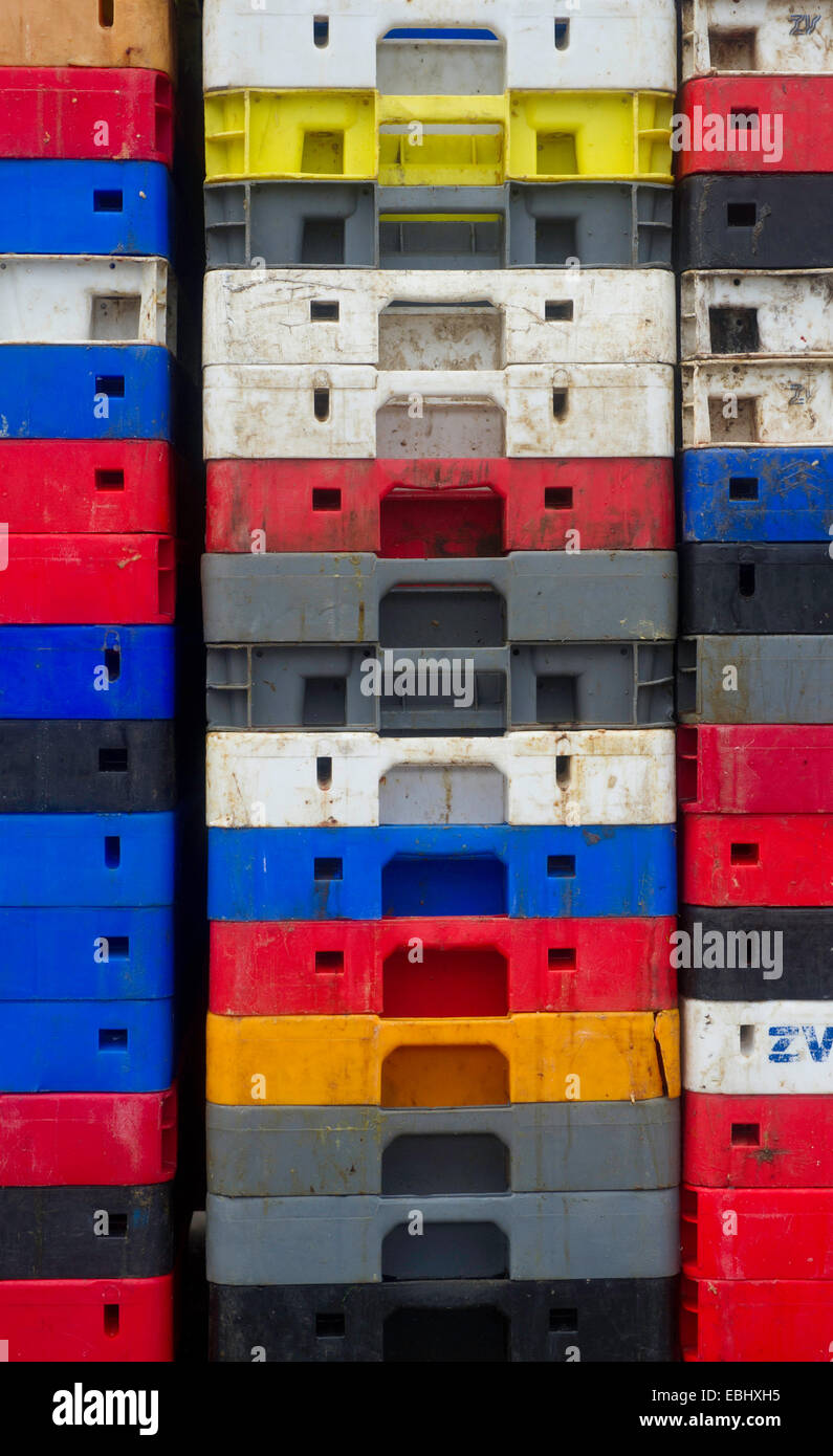 Fish crates different colours all stacked up Stock Photo - Alamy