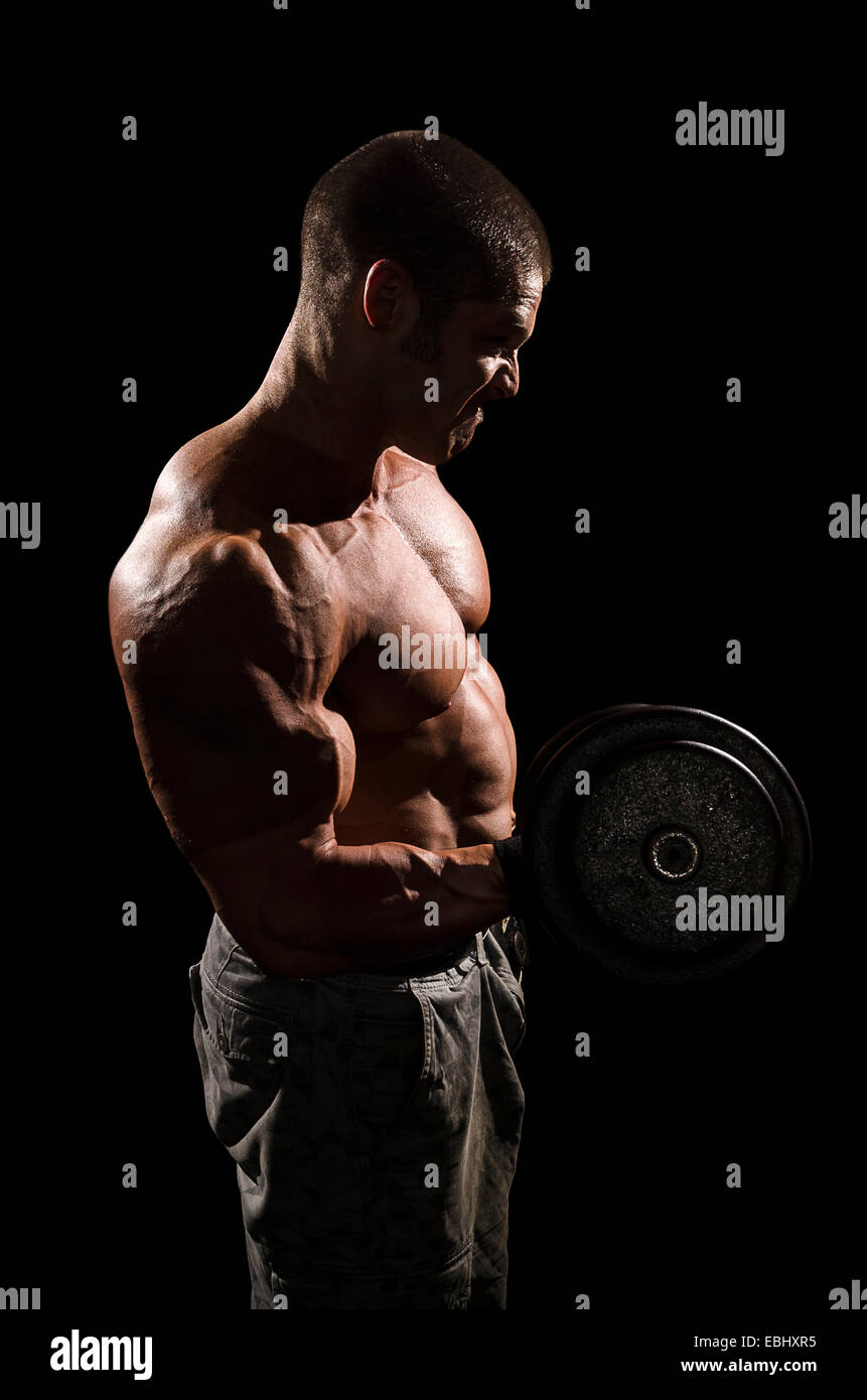 This is a strong athlete showing off his hard work and muscles Stock ...