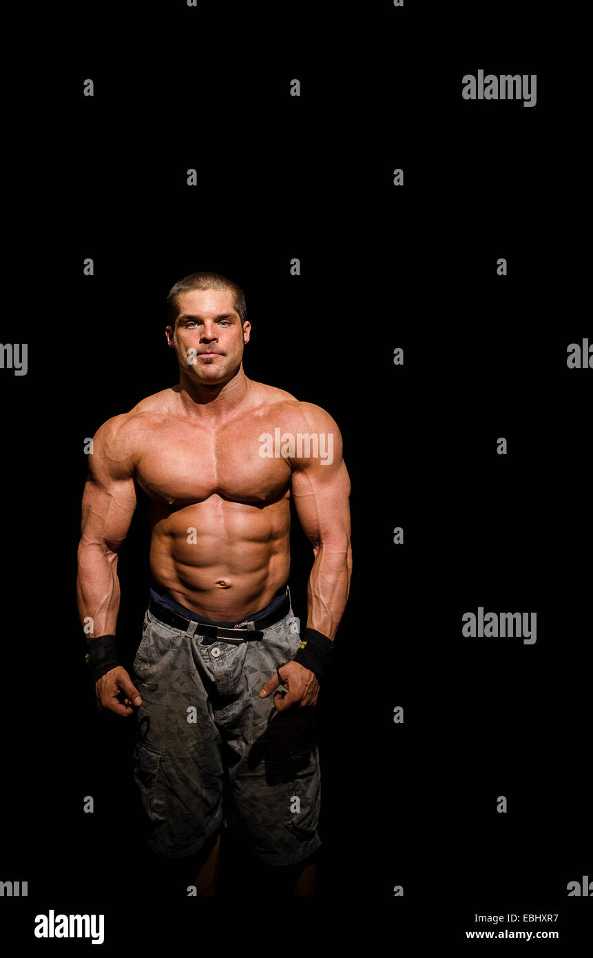 This is a strong athlete showing off his hard work and muscles Stock ...
