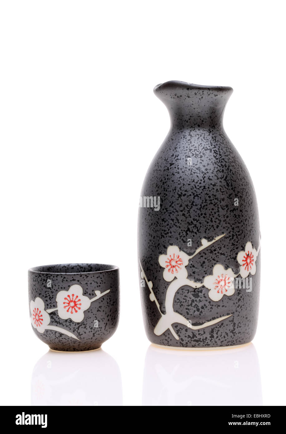 Japanese sake cup and bottle on white background Stock Photo - Alamy