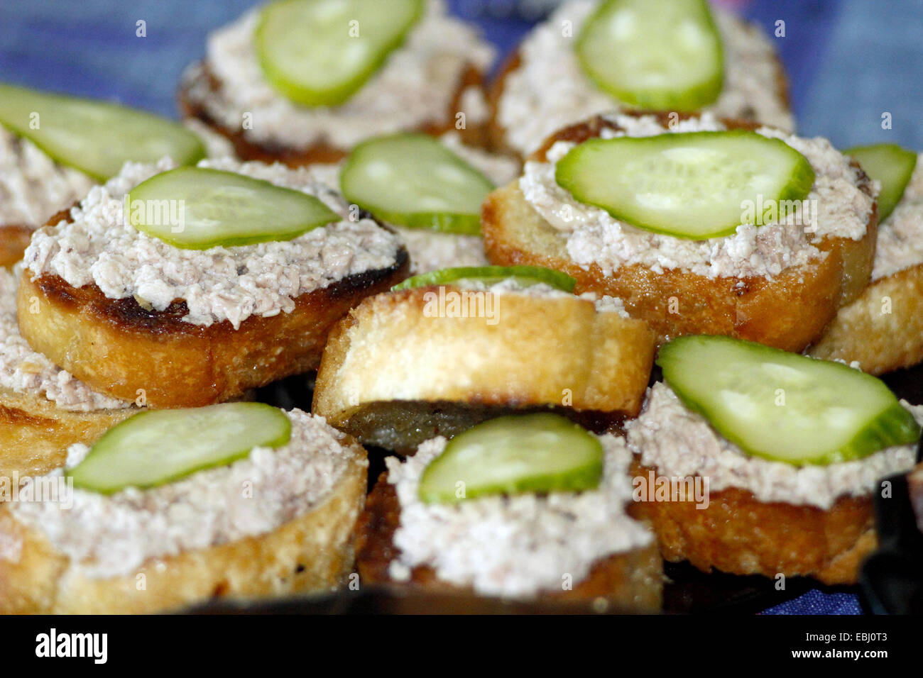 delicious toast with cod's liver and cucumbers Stock Photo - Alamy