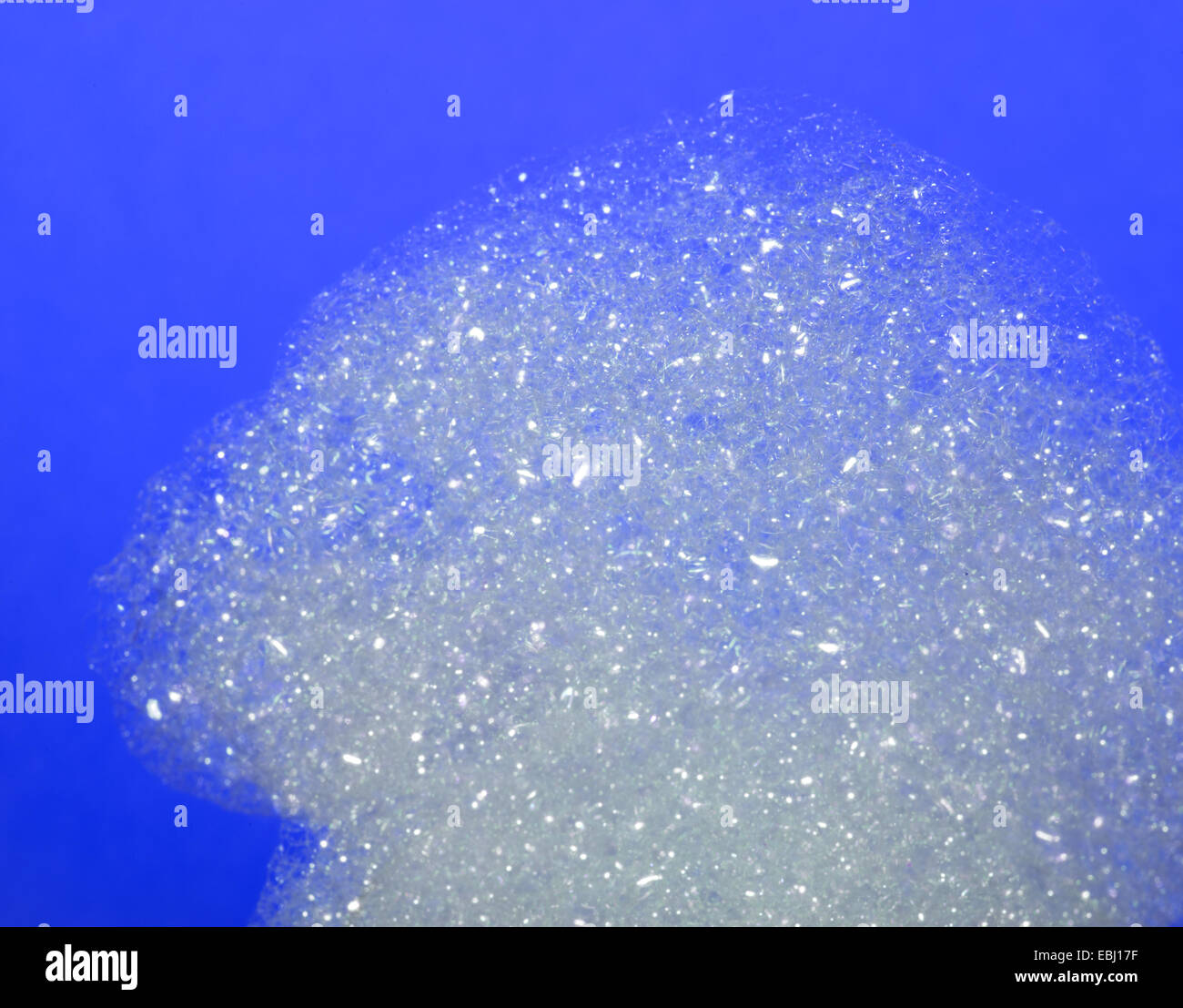 cloud of foam on blue background Stock Photo - Alamy