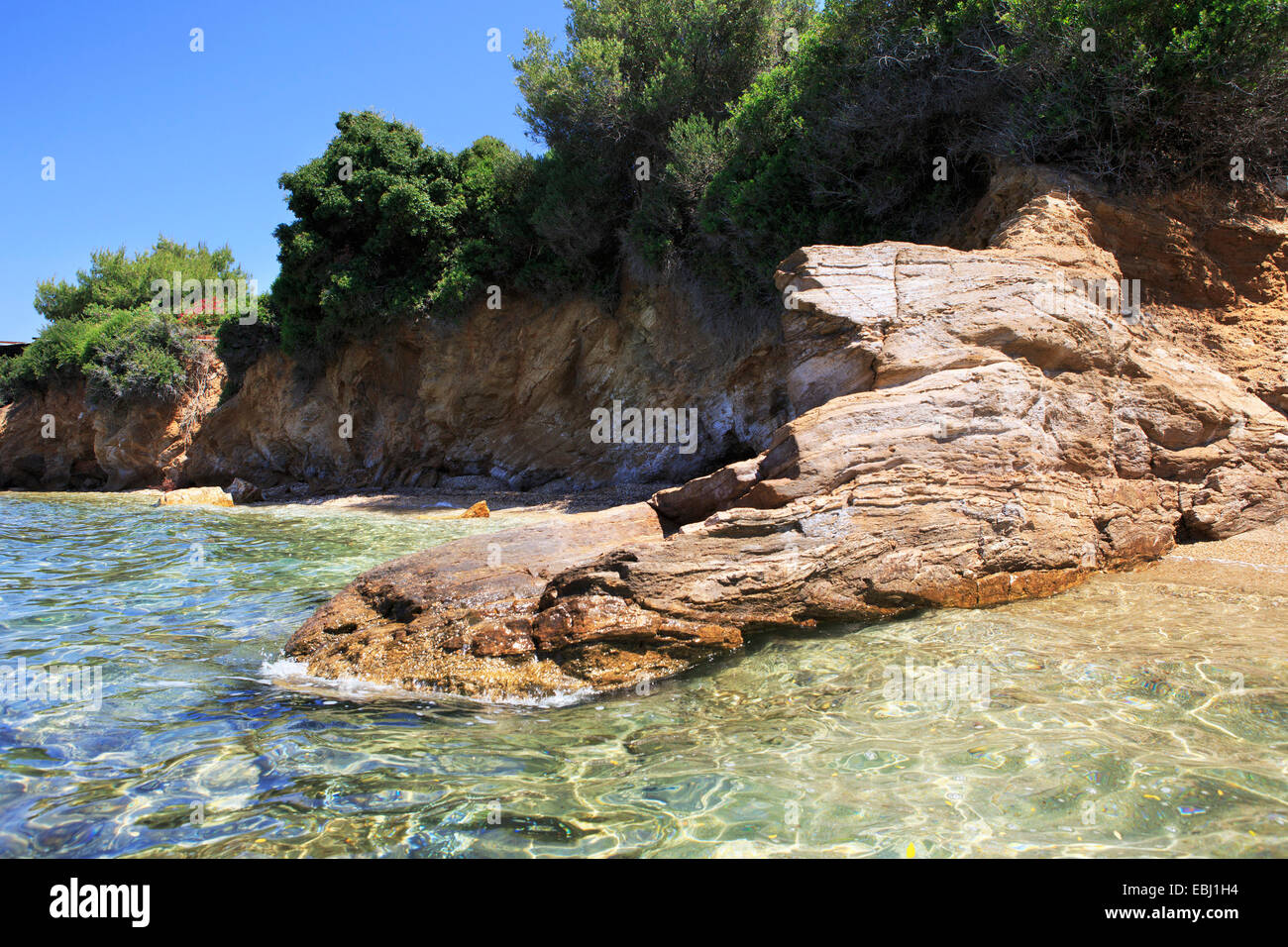 Stone ledge into the Aegean Sea Stock Photo - Alamy