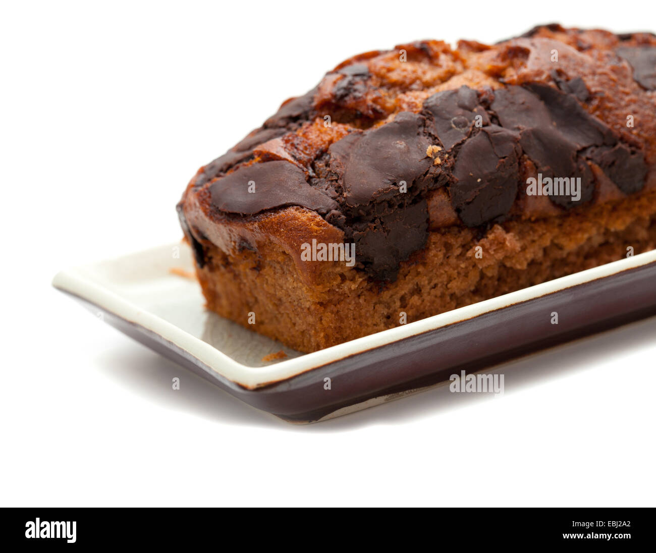 chocolate sponge cake bar on a plate, isolated on white Stock Photo - Alamy