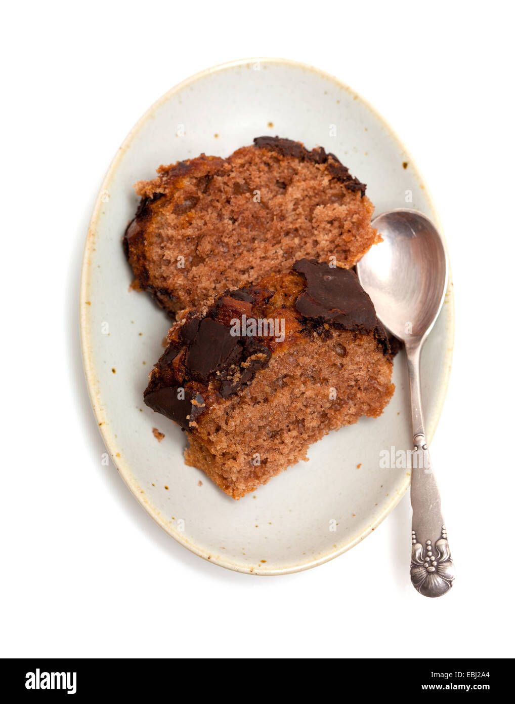 chocolate sponge cake bar on a plate, isolated on white Stock Photo - Alamy