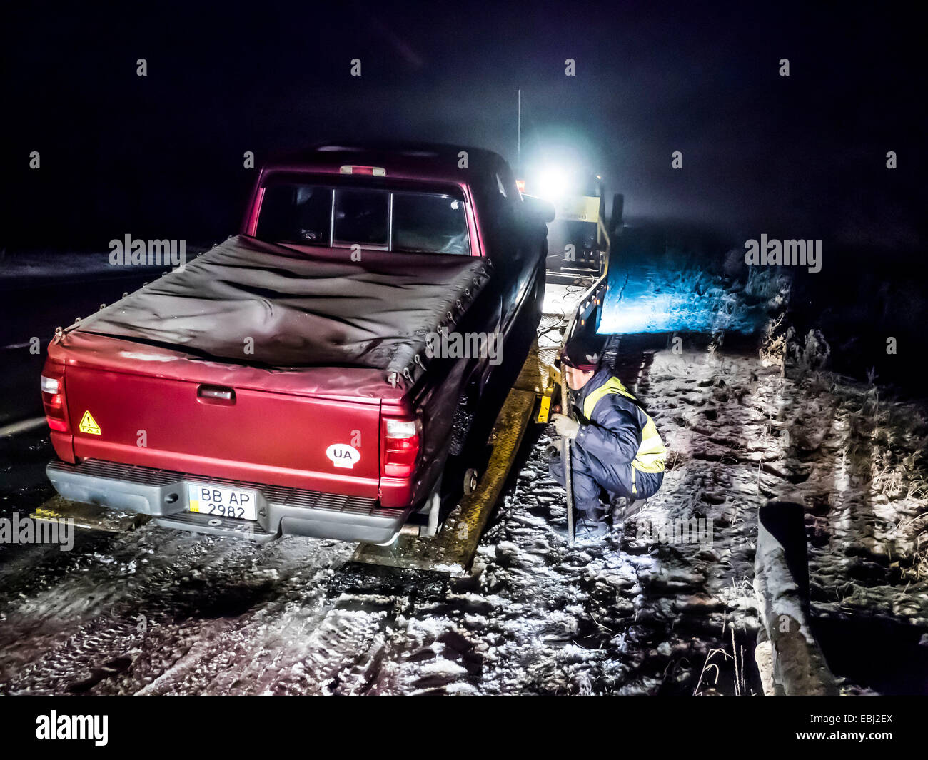 Truck Ford Ranger was evacuated after the breakdown on the winter road ...