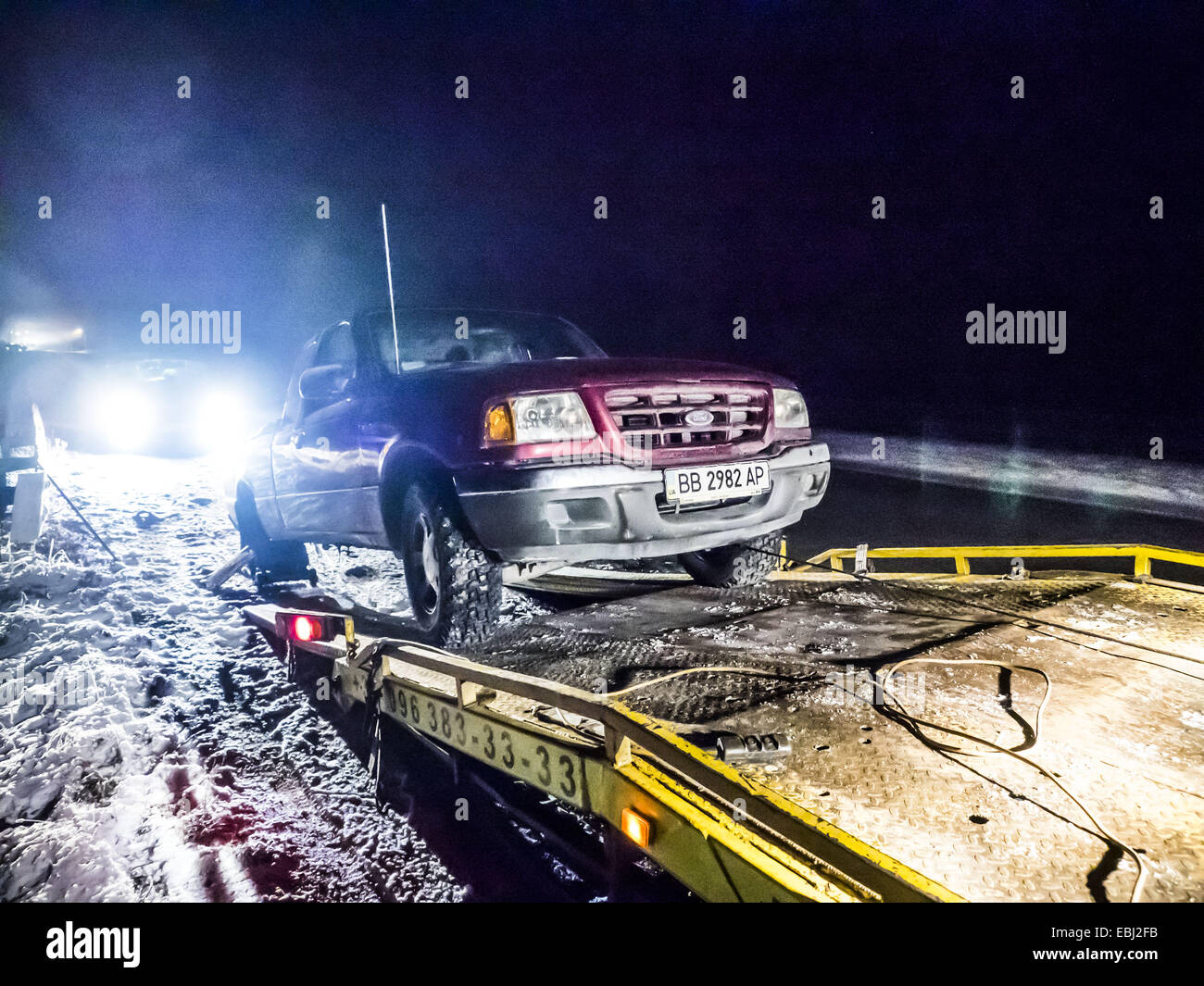 Truck Ford Ranger was evacuated after the breakdown on the winter road ...