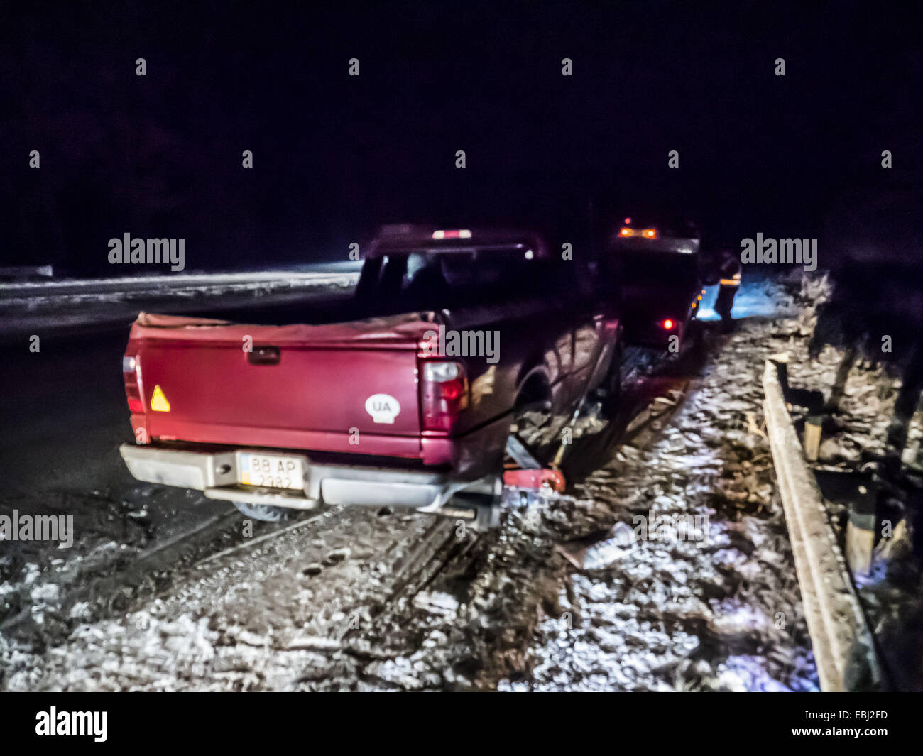 Truck Ford Ranger was evacuated after the breakdown on the winter road ...