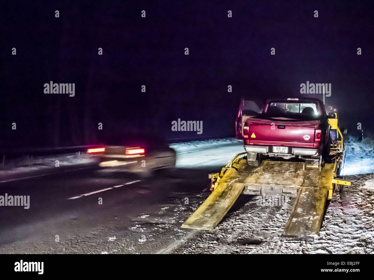 Truck Ford Ranger was evacuated after the breakdown on the winter road ...